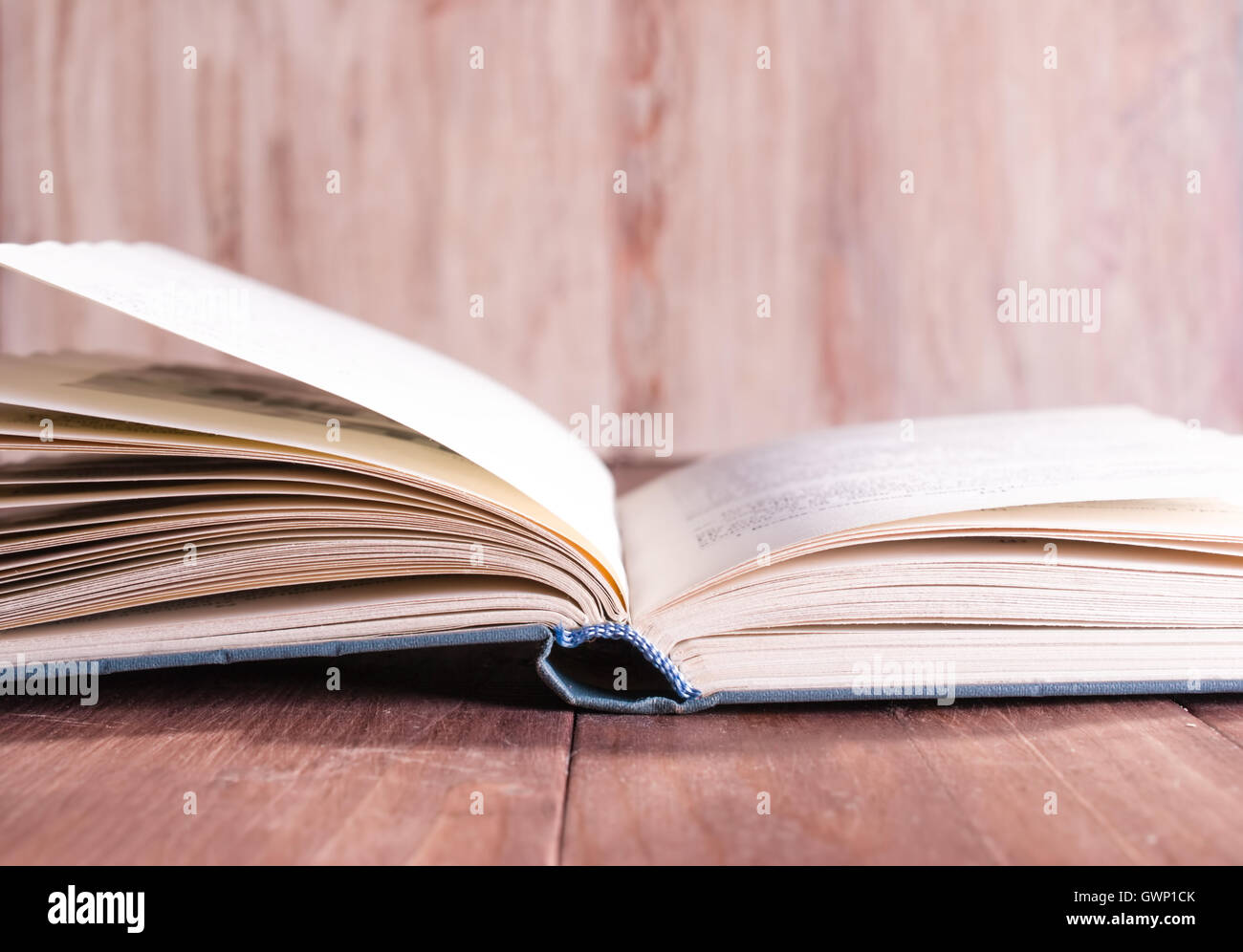 An open book on the table Stock Photo - Alamy