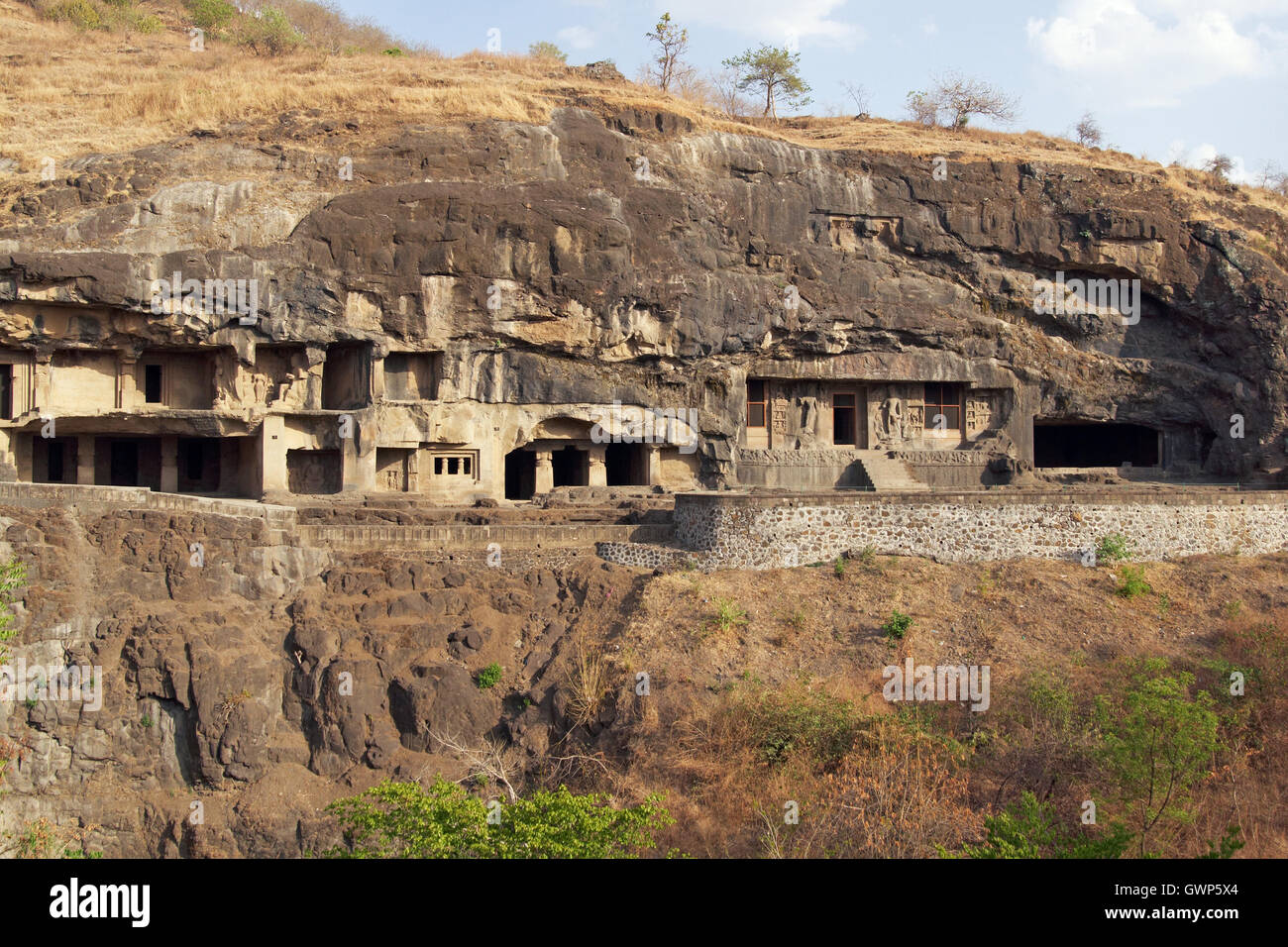 Buddhist cave temples carved out of the solid rock of the hillside at ...