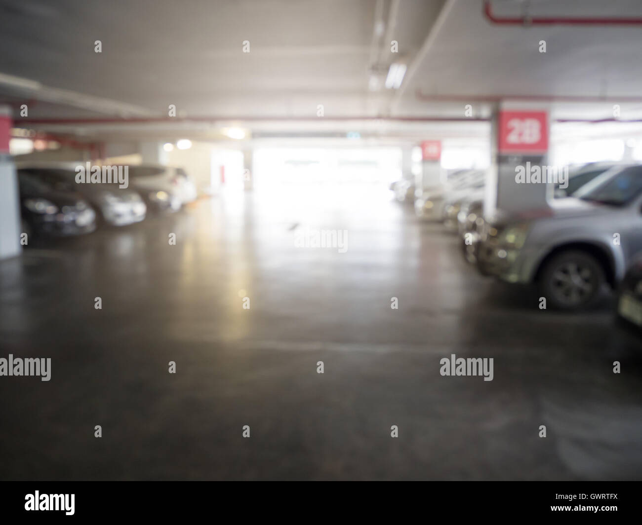 Blurred parking garage at shopping mall Stock Photo - Alamy