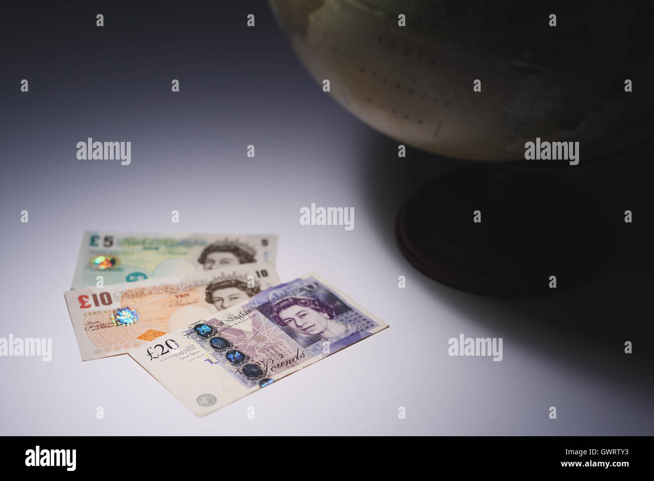Pounds on world map Stock Photo - Alamy