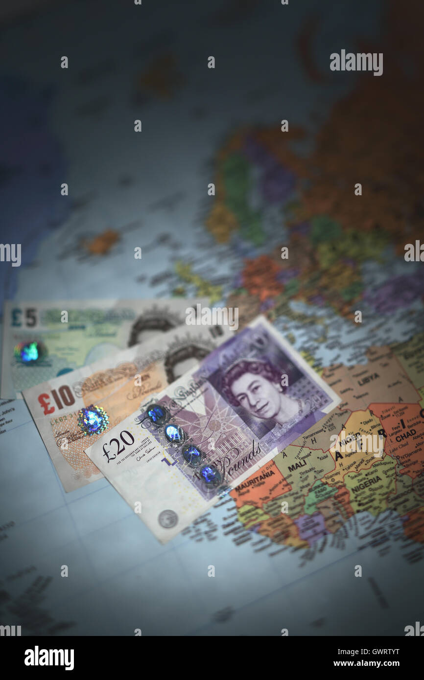 Pounds on world map Stock Photo - Alamy