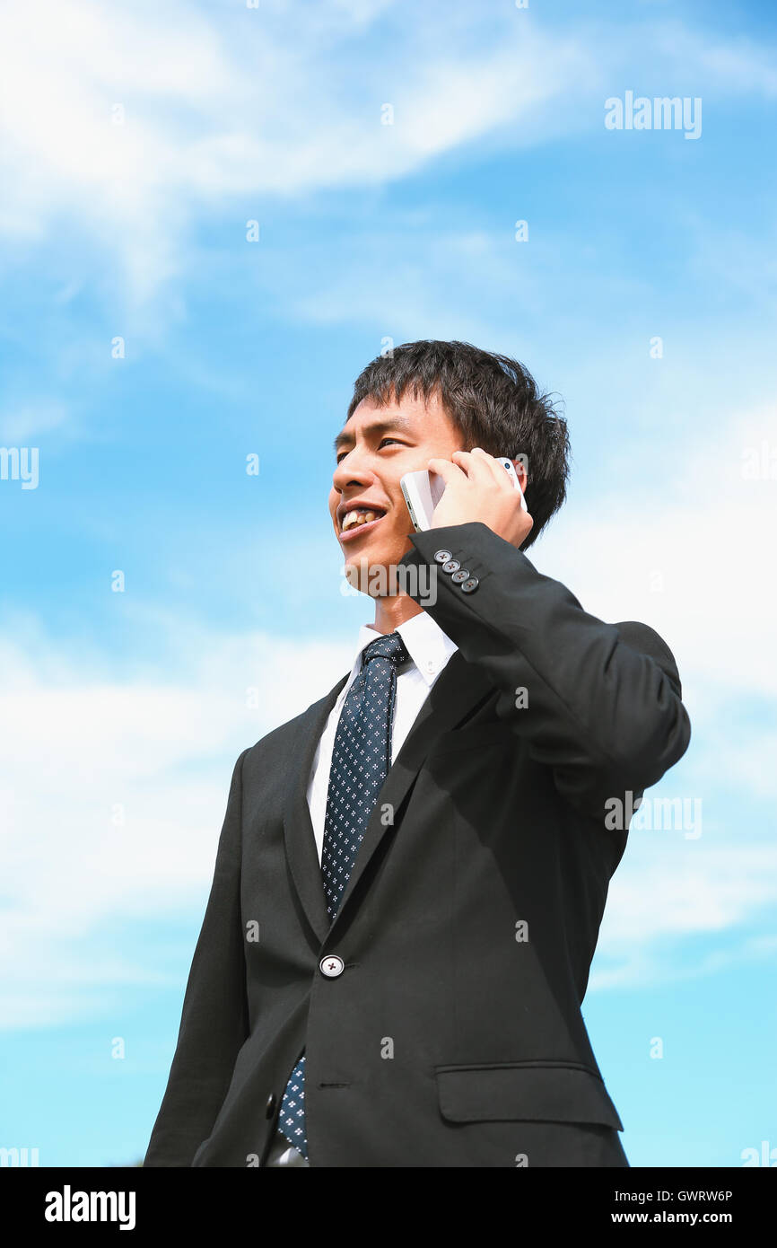 Young Japanese businessman on the phone Stock Photo - Alamy