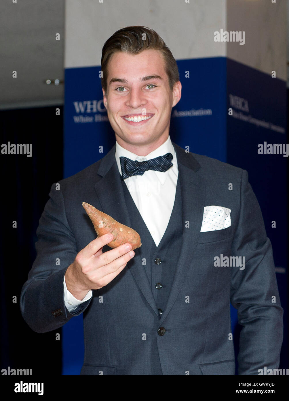 Marcus Johns poses with a sweet potato as he arrives for the 2015 White ...
