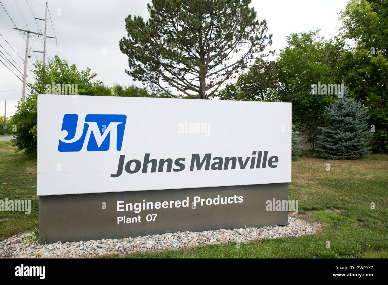 A logo sign outside of a facility occupied by Johns Manville in ...