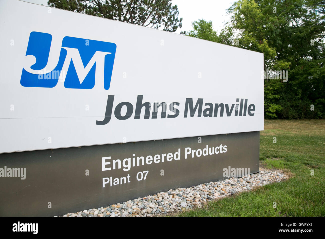 A logo sign outside of a facility occupied by Johns Manville in ...
