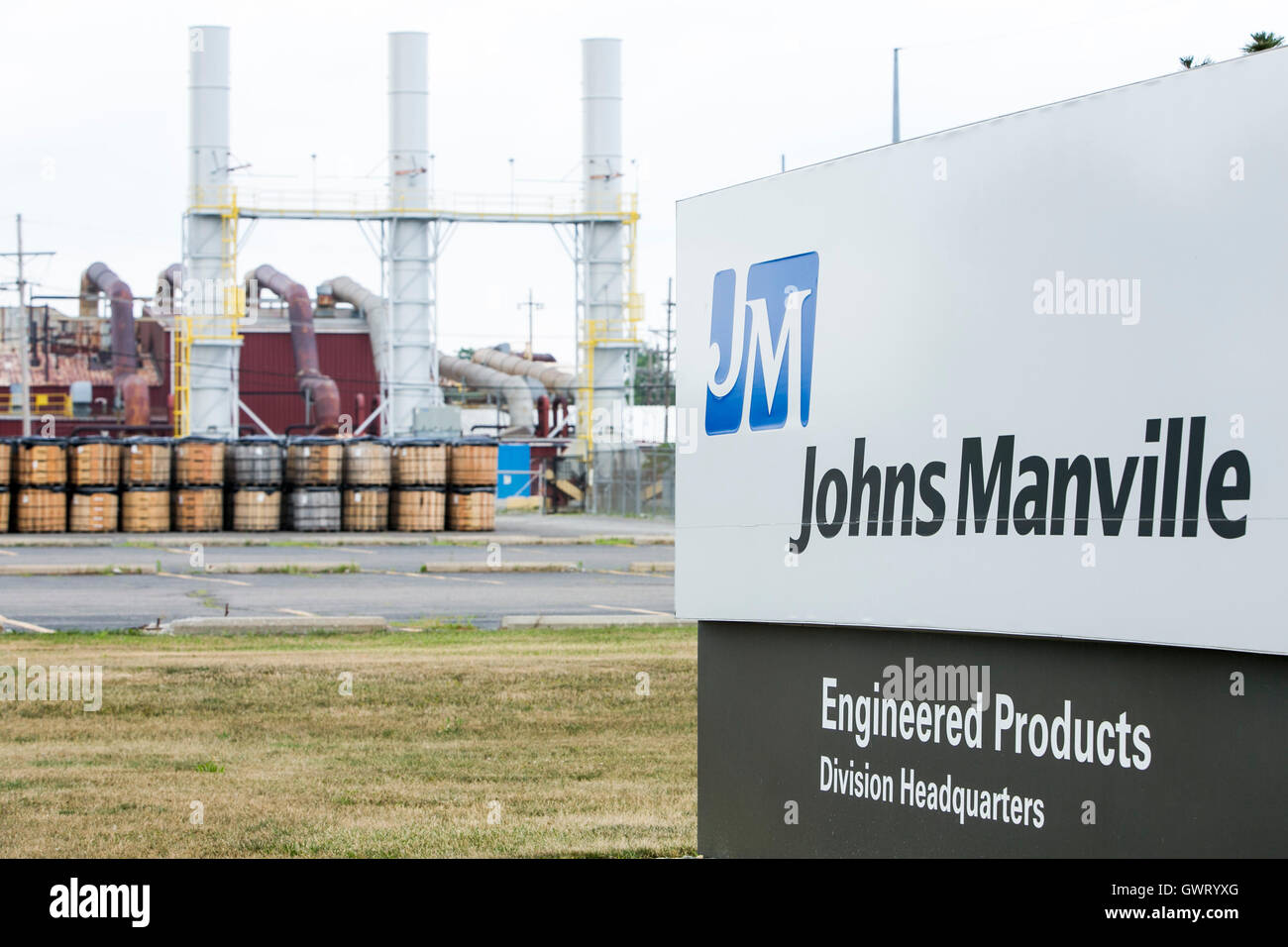 A logo sign outside of a facility occupied by Johns Manville in ...