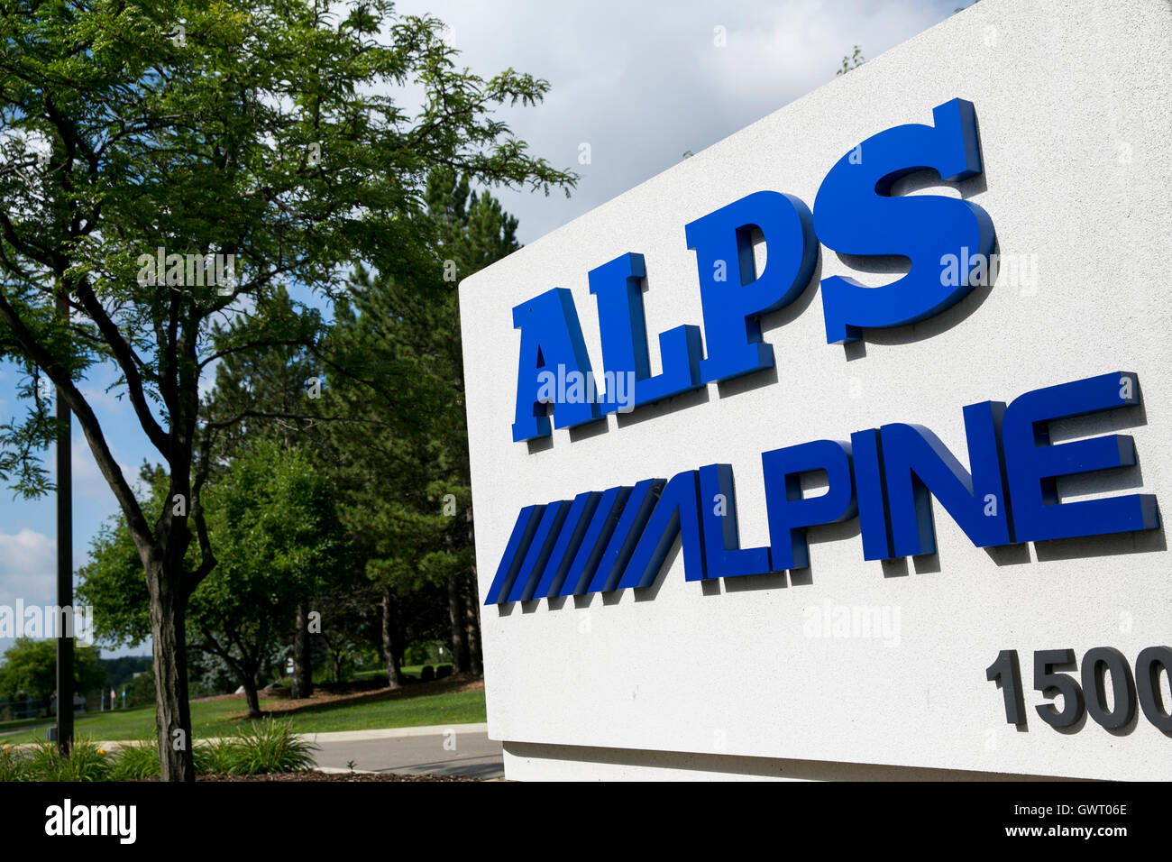 A logo sign outside of a facility occupied by Alps Electric Co., Ltd ...