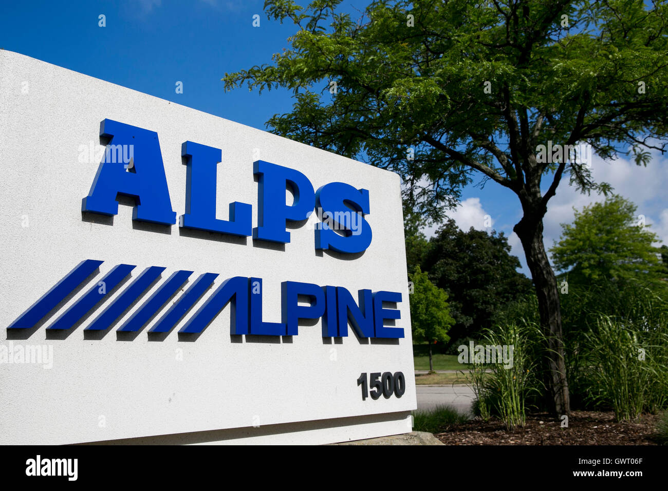 A logo sign outside of a facility occupied by Alps Electric Co., Ltd ...