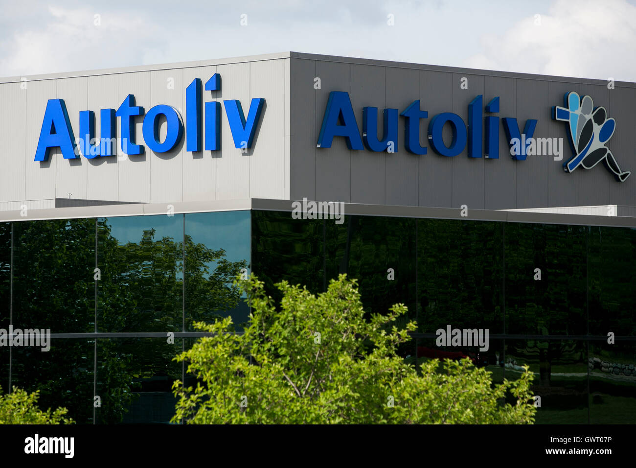 A logo sign outside of a facility occupied by Autoliv in Auburn Hills ...