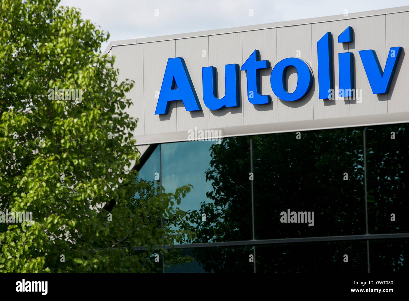 A logo sign outside of a facility occupied by Autoliv in Auburn Hills ...