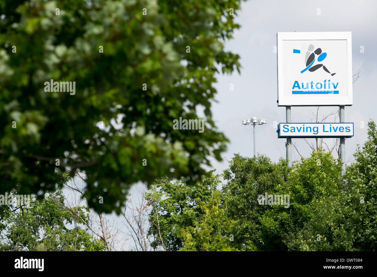 A logo sign outside of a facility occupied by Autoliv in Auburn Hills ...
