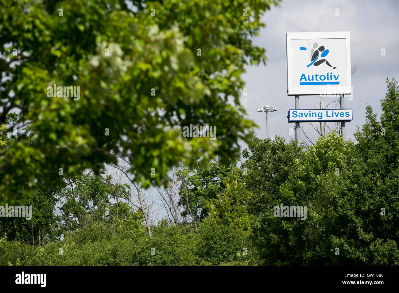A logo sign outside of a facility occupied by Autoliv in Auburn Hills ...
