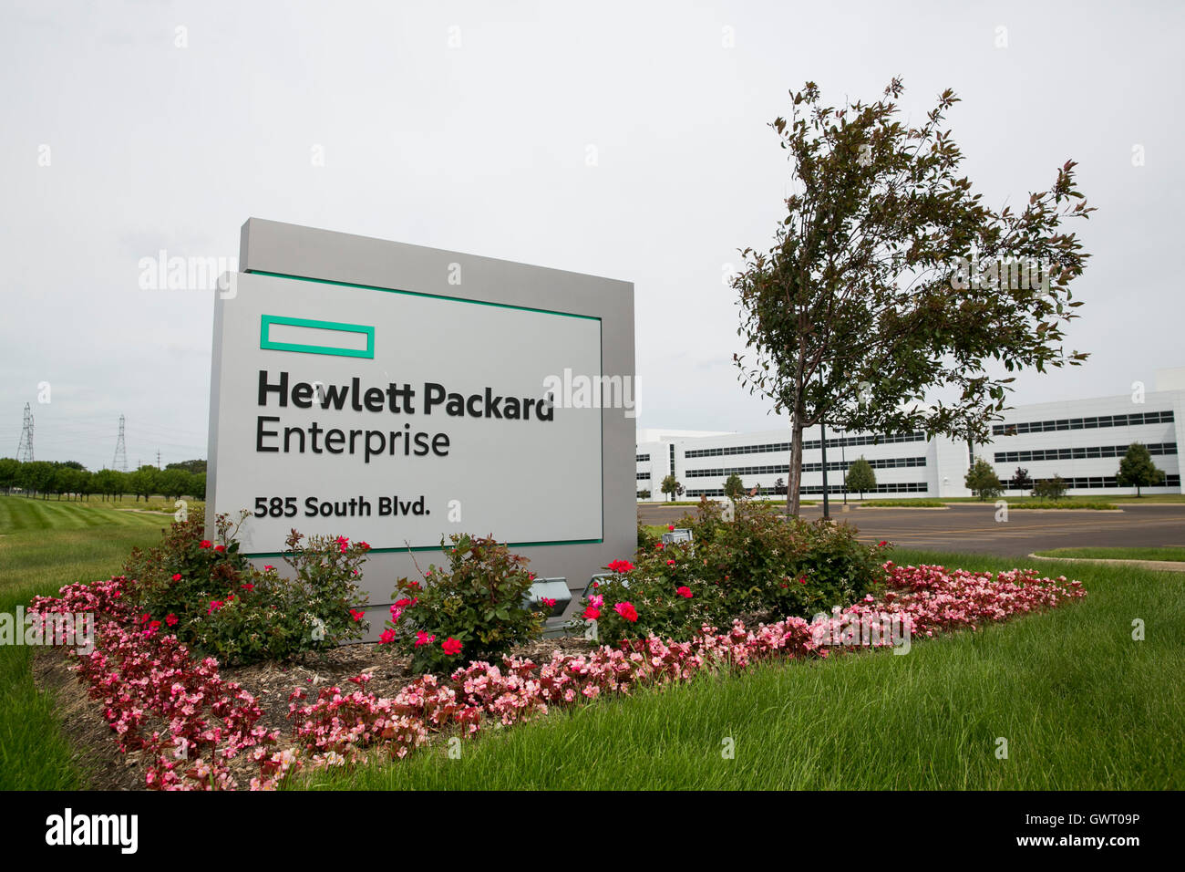 A logo sign outside of a facility occupied by Hewlett Packard ...