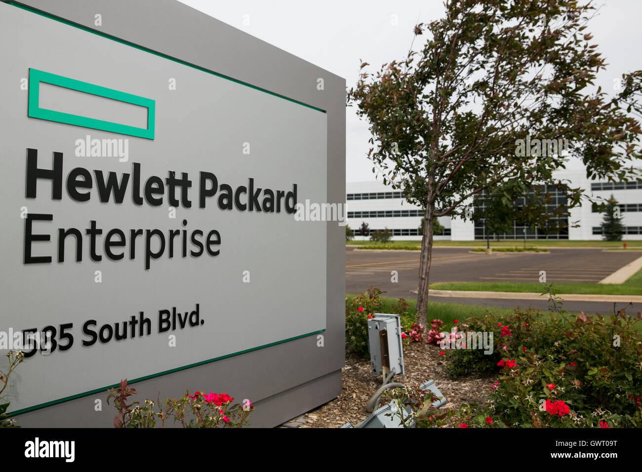 A logo sign outside of a facility occupied by Hewlett Packard ...