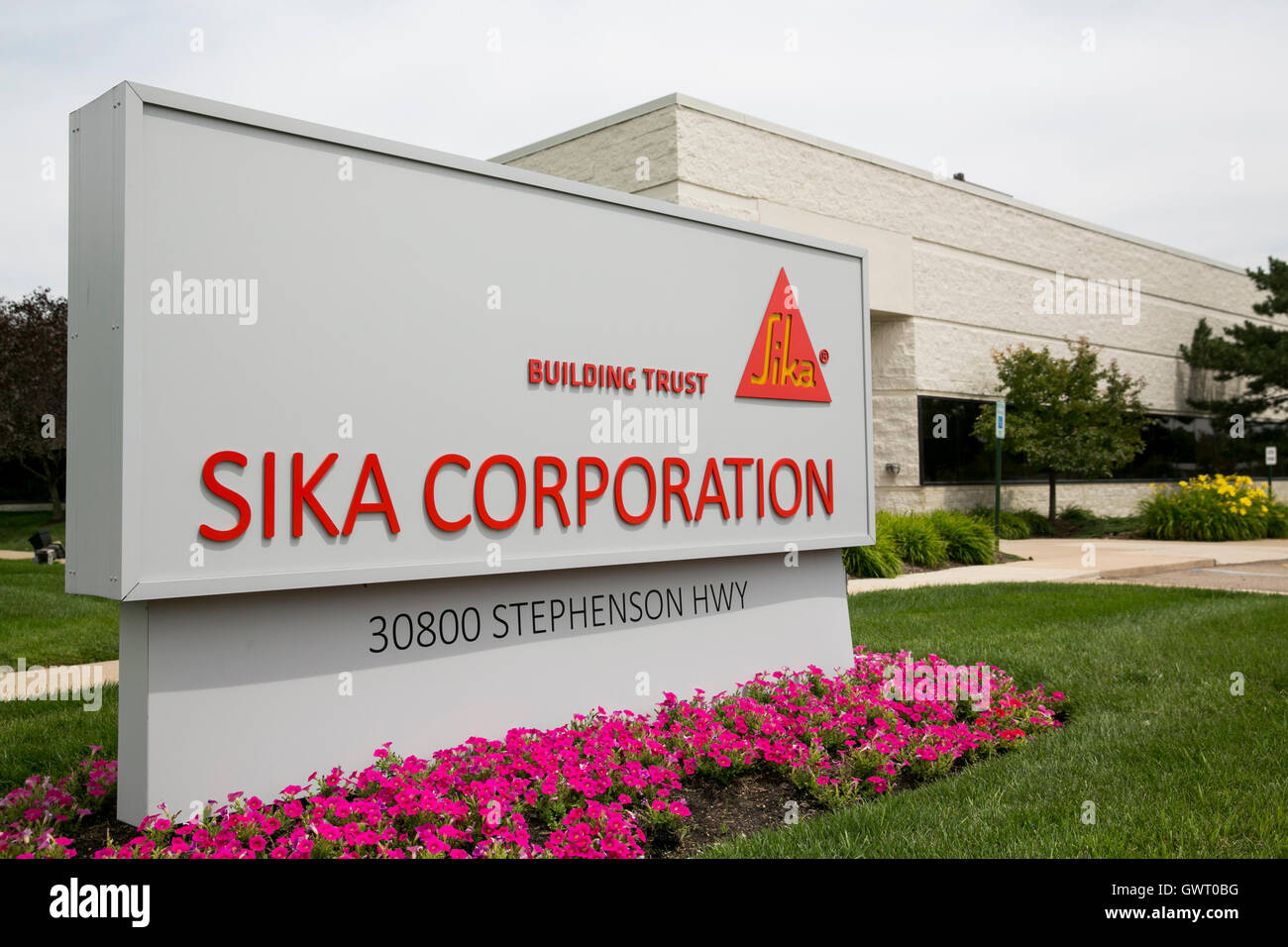 A logo sign outside of a facility occupied by the Sika Corporation in ...