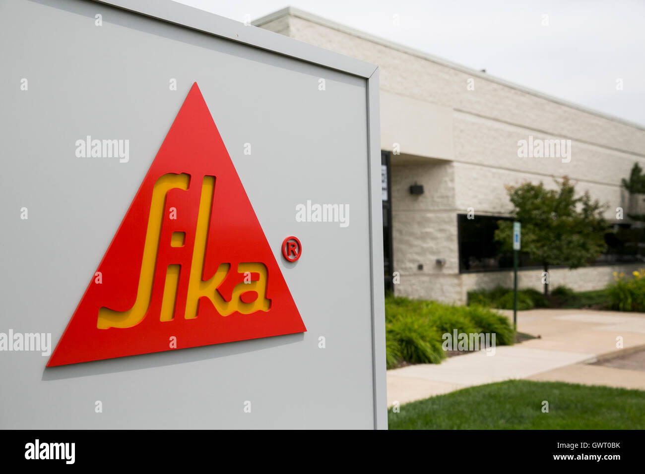 A logo sign outside of a facility occupied by the Sika Corporation in ...