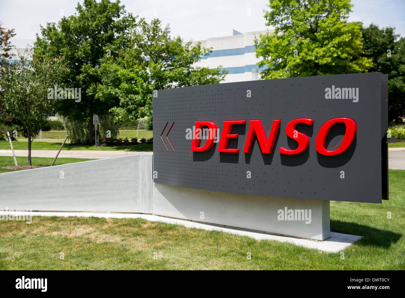 A logo sign outside of a facility occupied by the Denso Corporation in ...