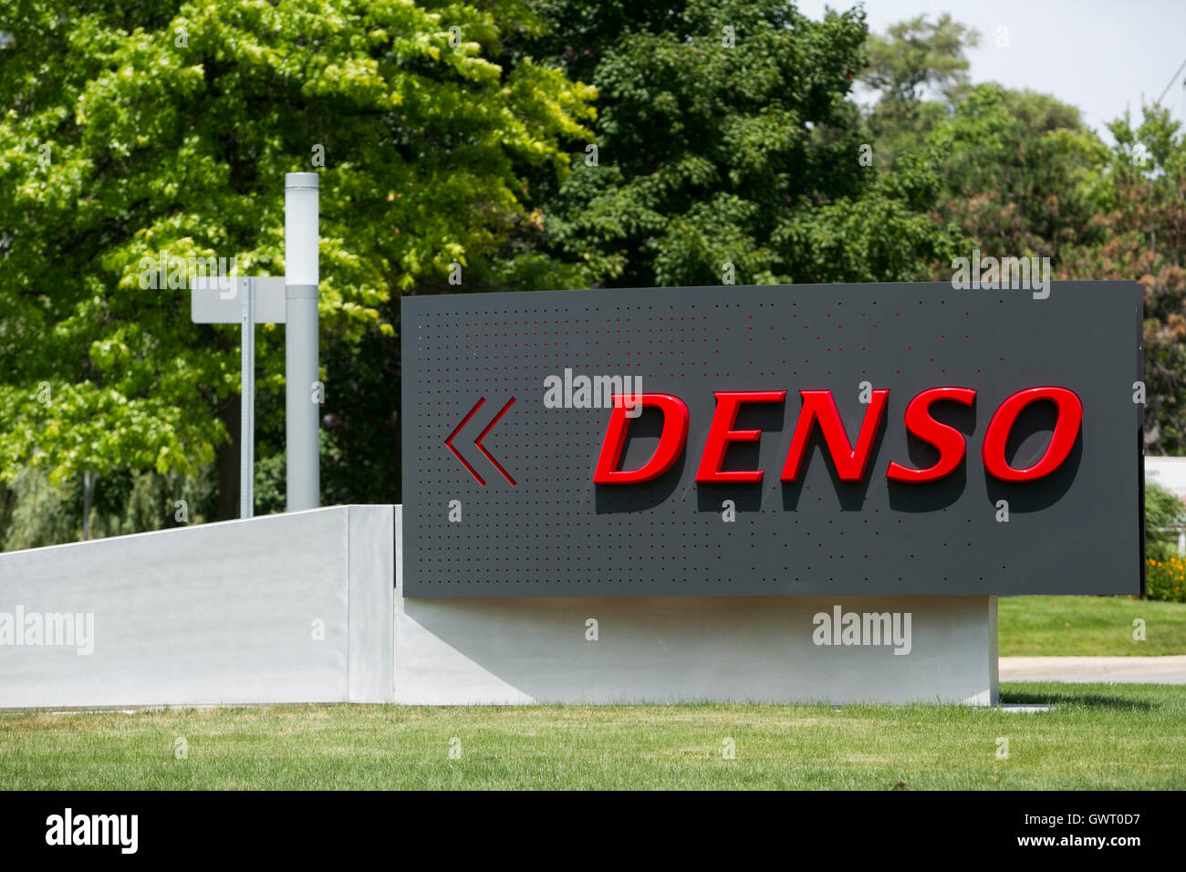 A logo sign outside of a facility occupied by the Denso Corporation in ...