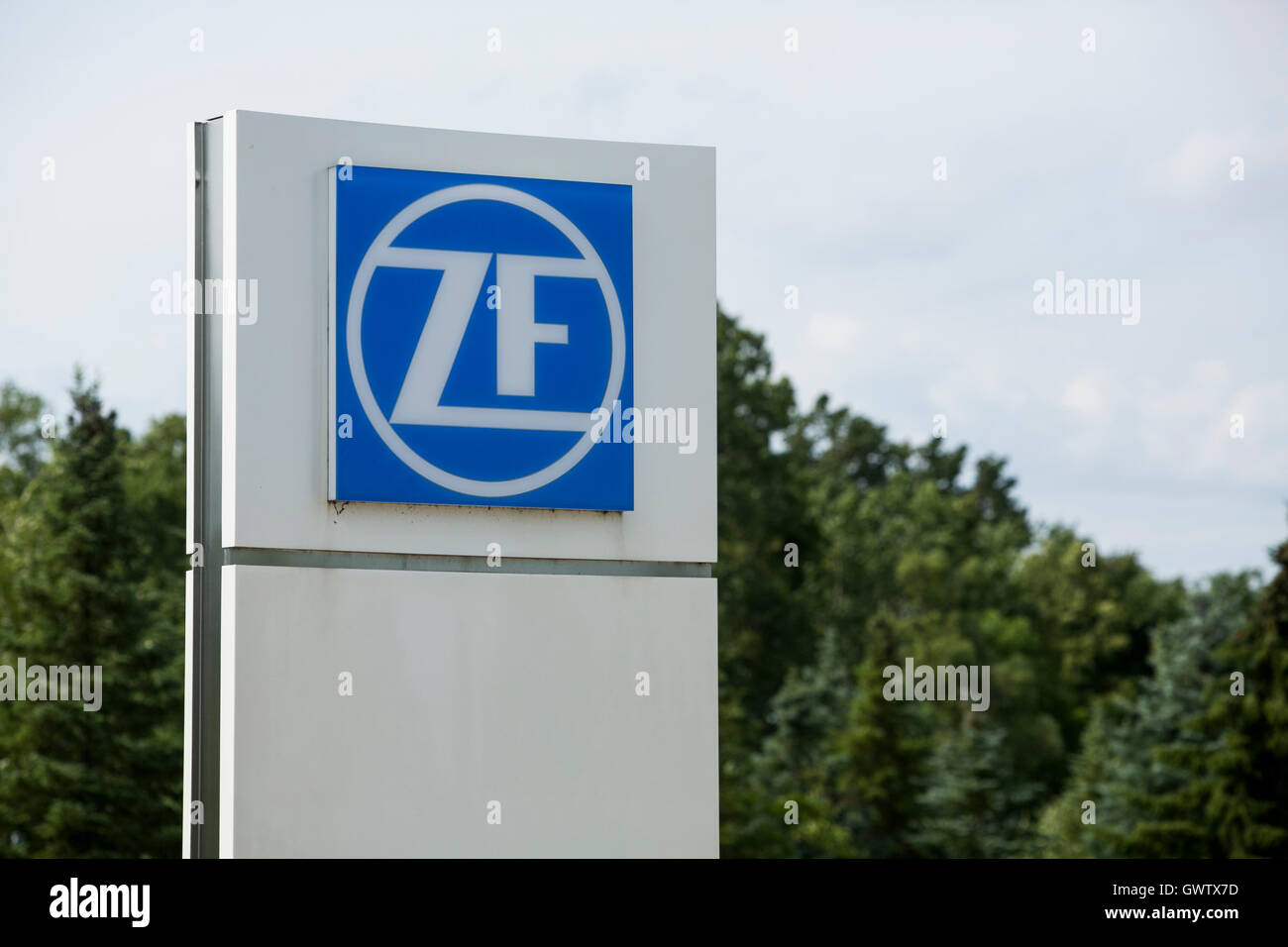 A logo sign outside of a facility occupied by ZF Friedrichshafen AG in ...