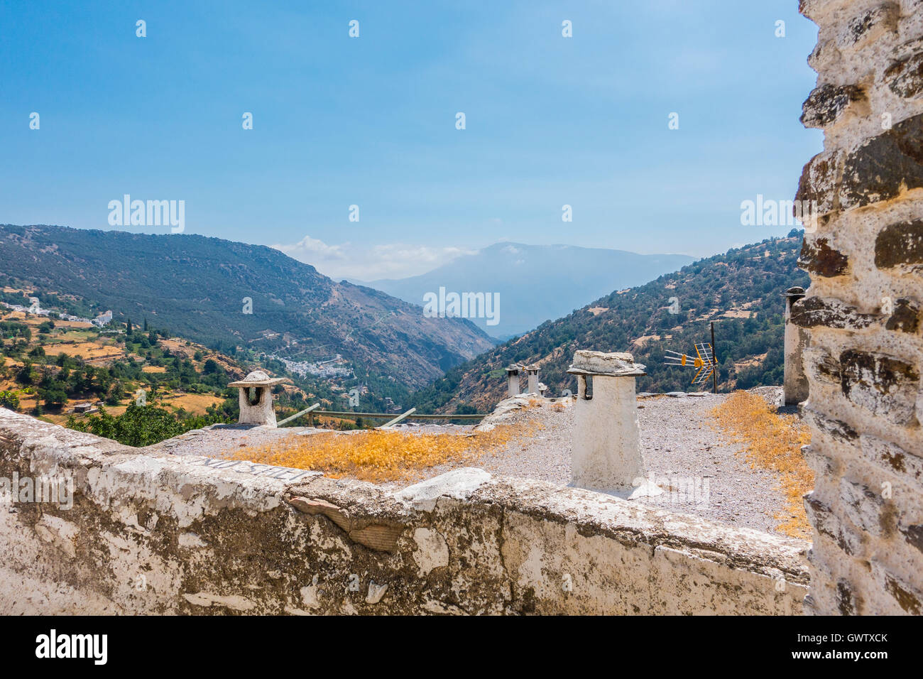 Unique chimneys of Capileira, Spain, a "white village Stock Photo - Alamy