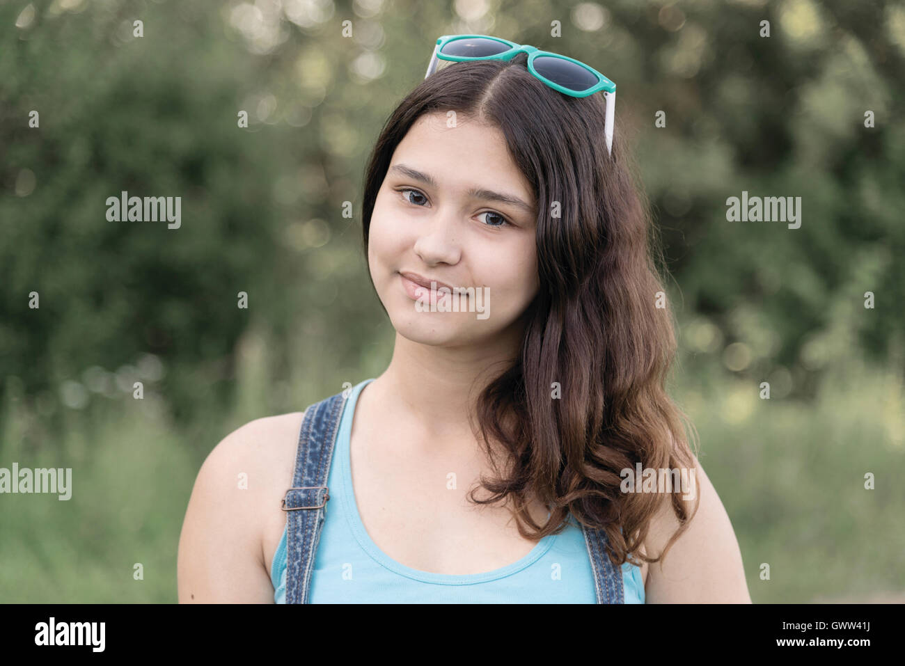 Portrait of modest teen girl on nature summer Stock Photo - Alamy