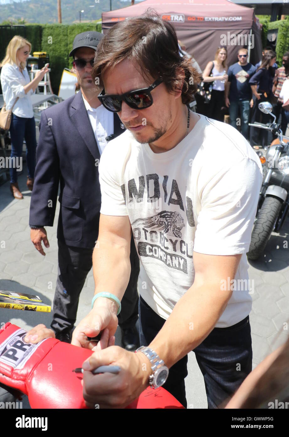 Mark Wahlberg greets fans and signs autographs at Extra in Universal ...