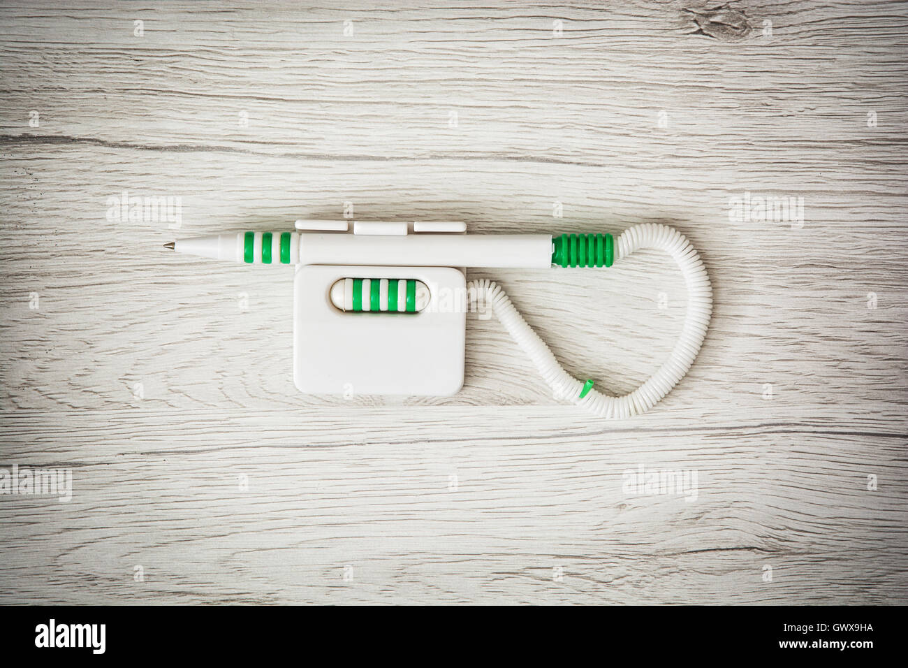 Simple office pen on the wooden texture. Office accessory. Pen on the ...