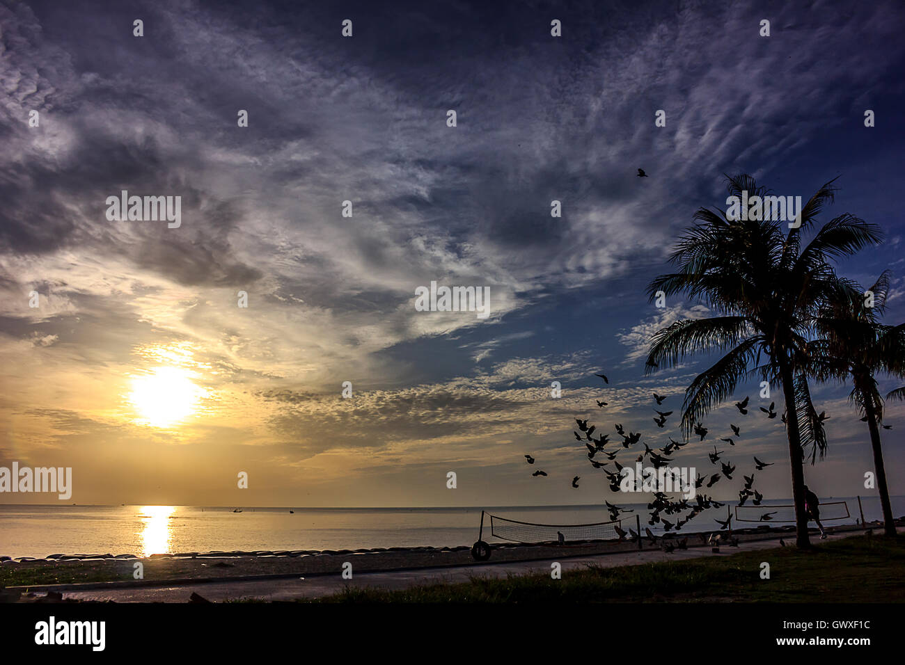 Beautiful sunrise on the songkhla beach Stock Photo - Alamy
