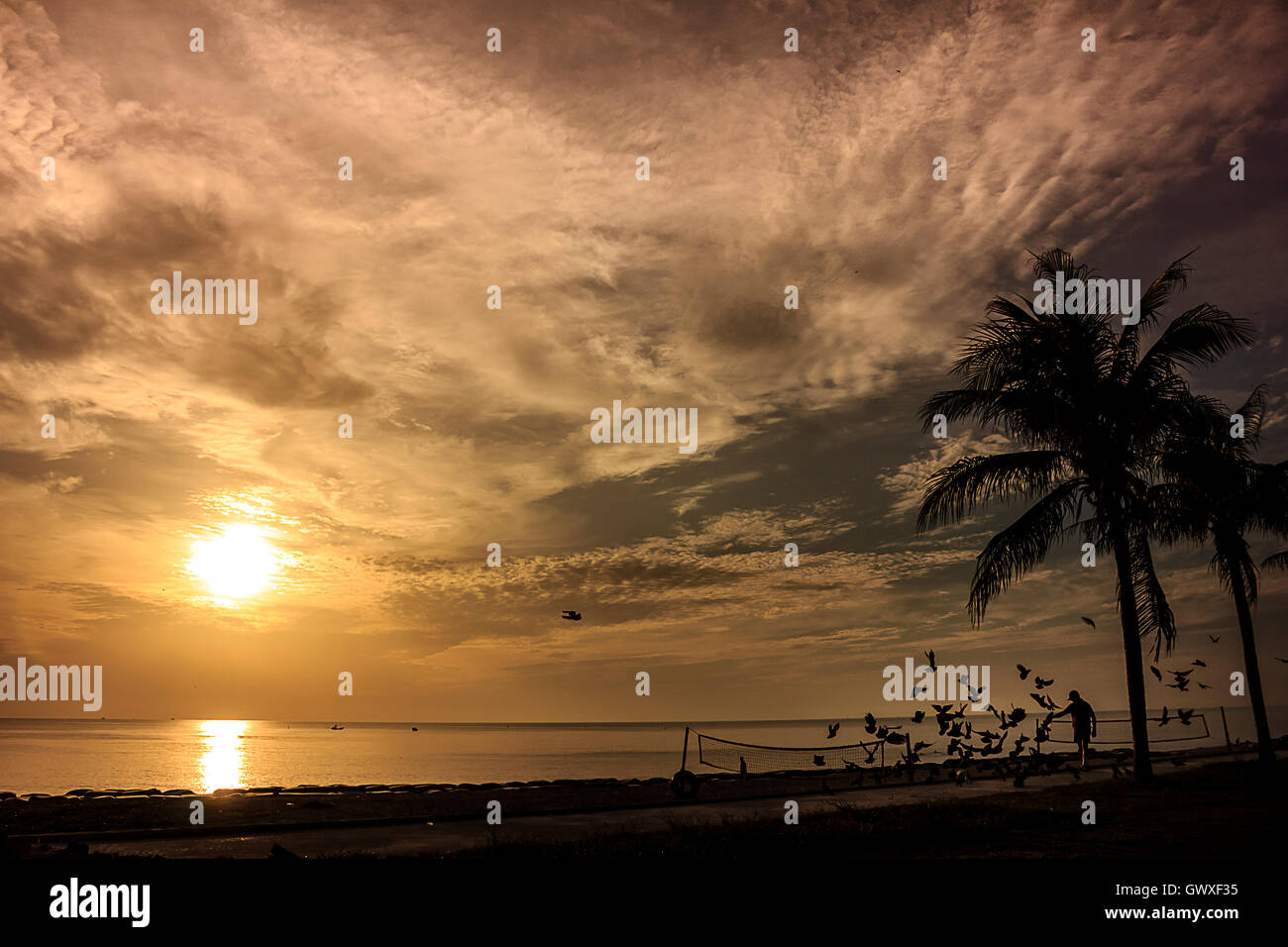 Beautiful sunrise on the songkhla beach Stock Photo - Alamy