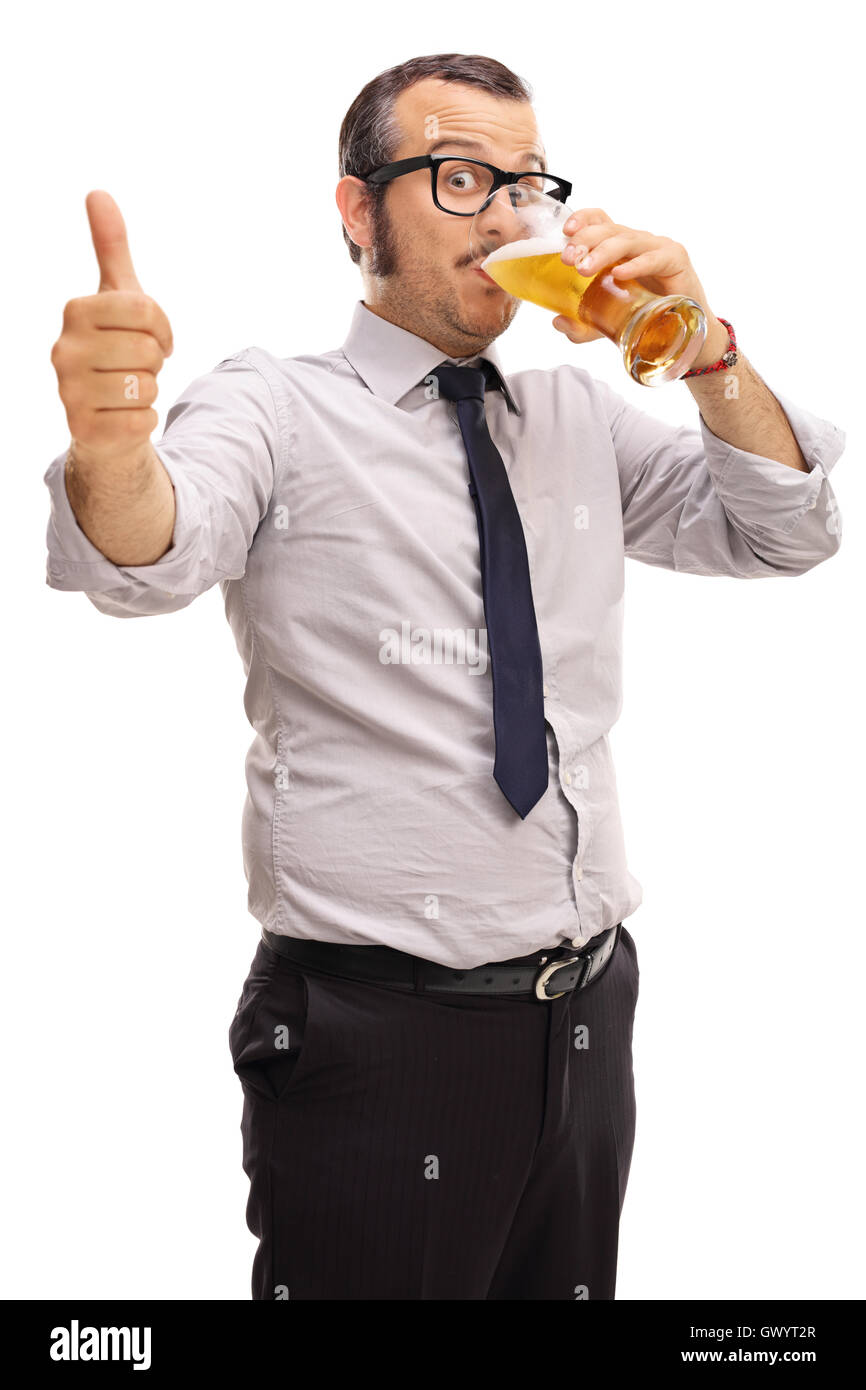 Young businessman drinking beer and giving a thumb up isolated on white ...