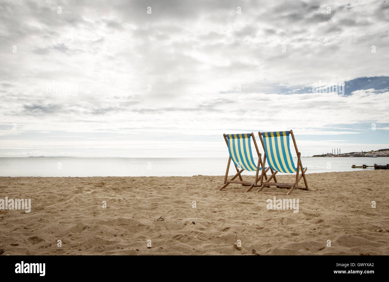 deck chairs set up on swanage beach Stock Photo - Alamy