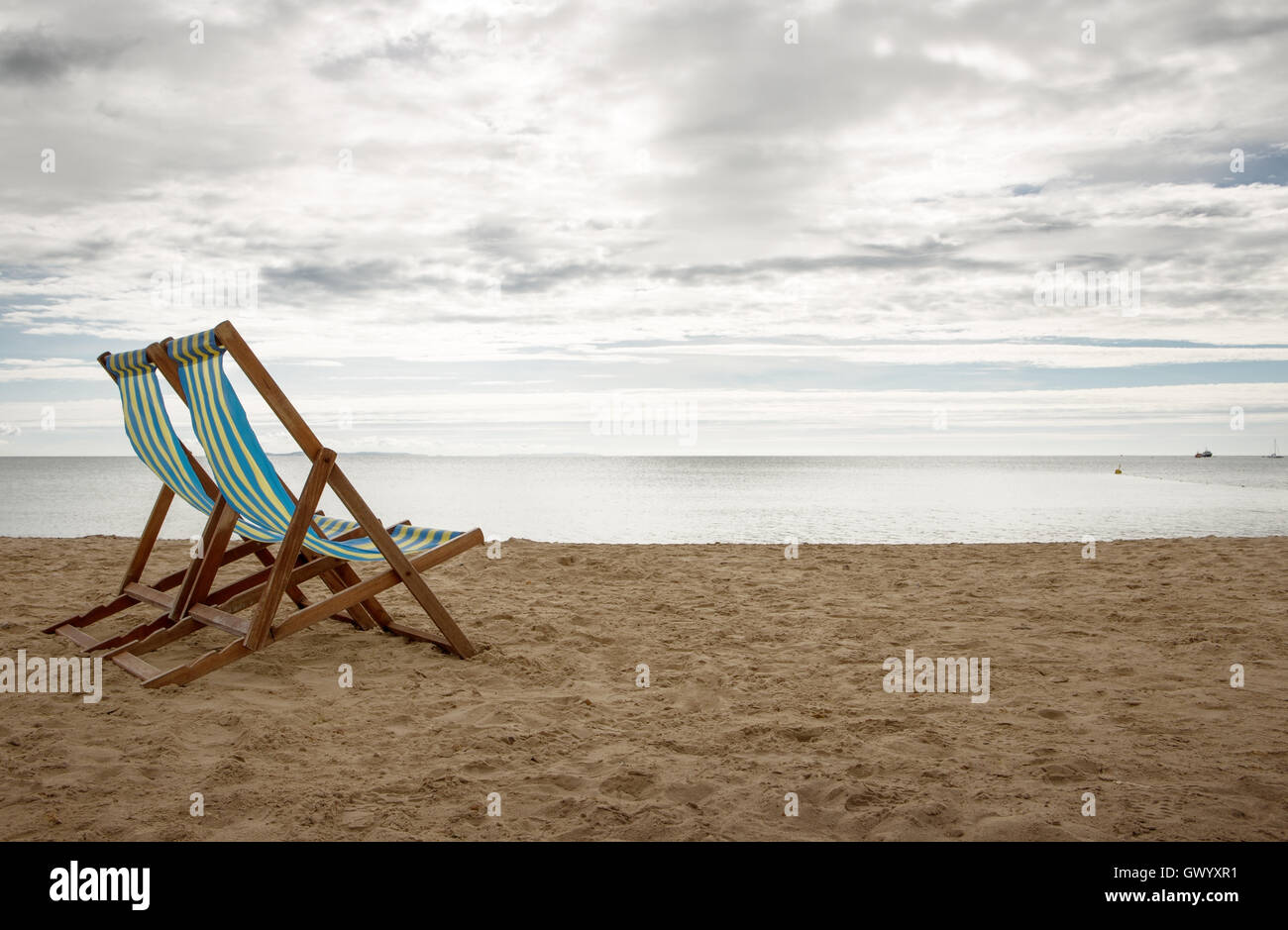 deck chairs set up on swanage beach Stock Photo - Alamy
