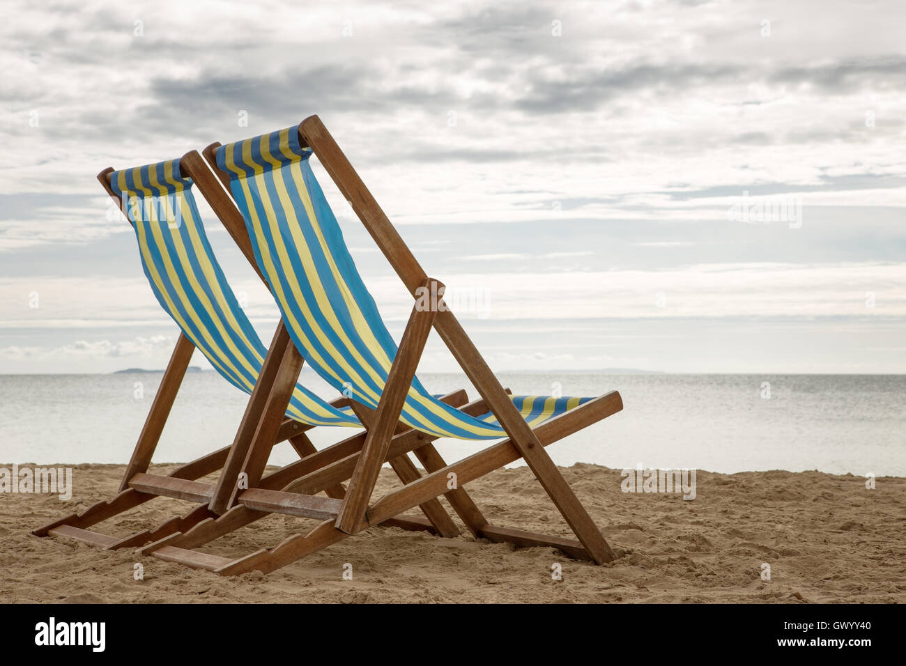 deck chairs set up on swanage beach Stock Photo - Alamy