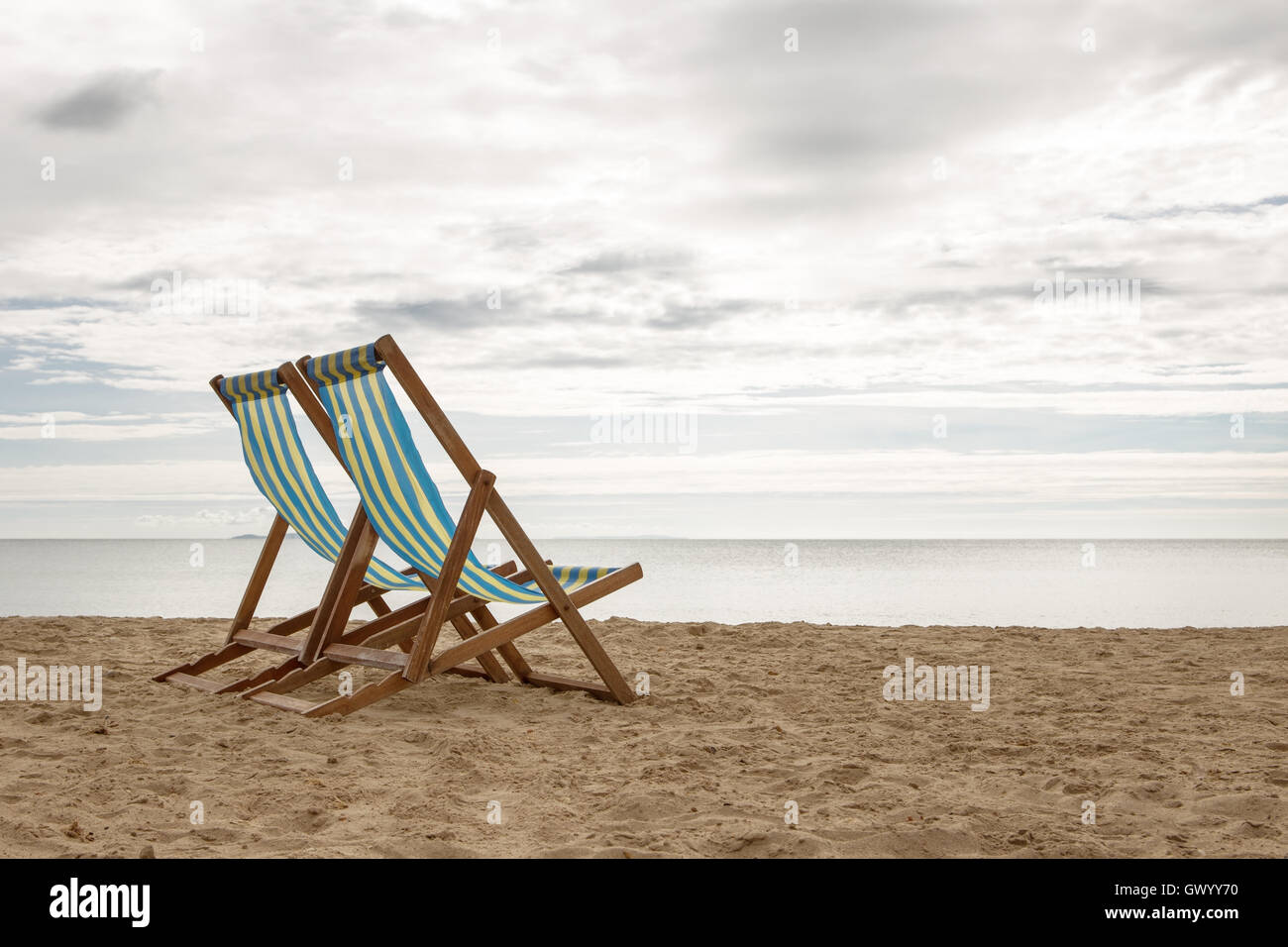 deck chairs set up on swanage beach Stock Photo - Alamy