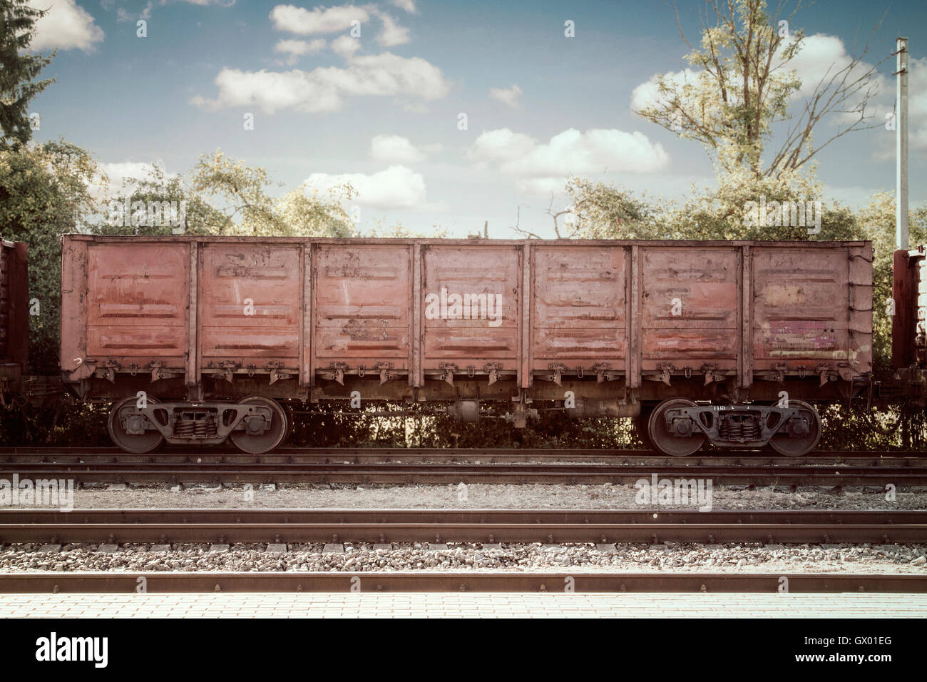 Metal cargo train container on railway at the station Stock Photo - Alamy