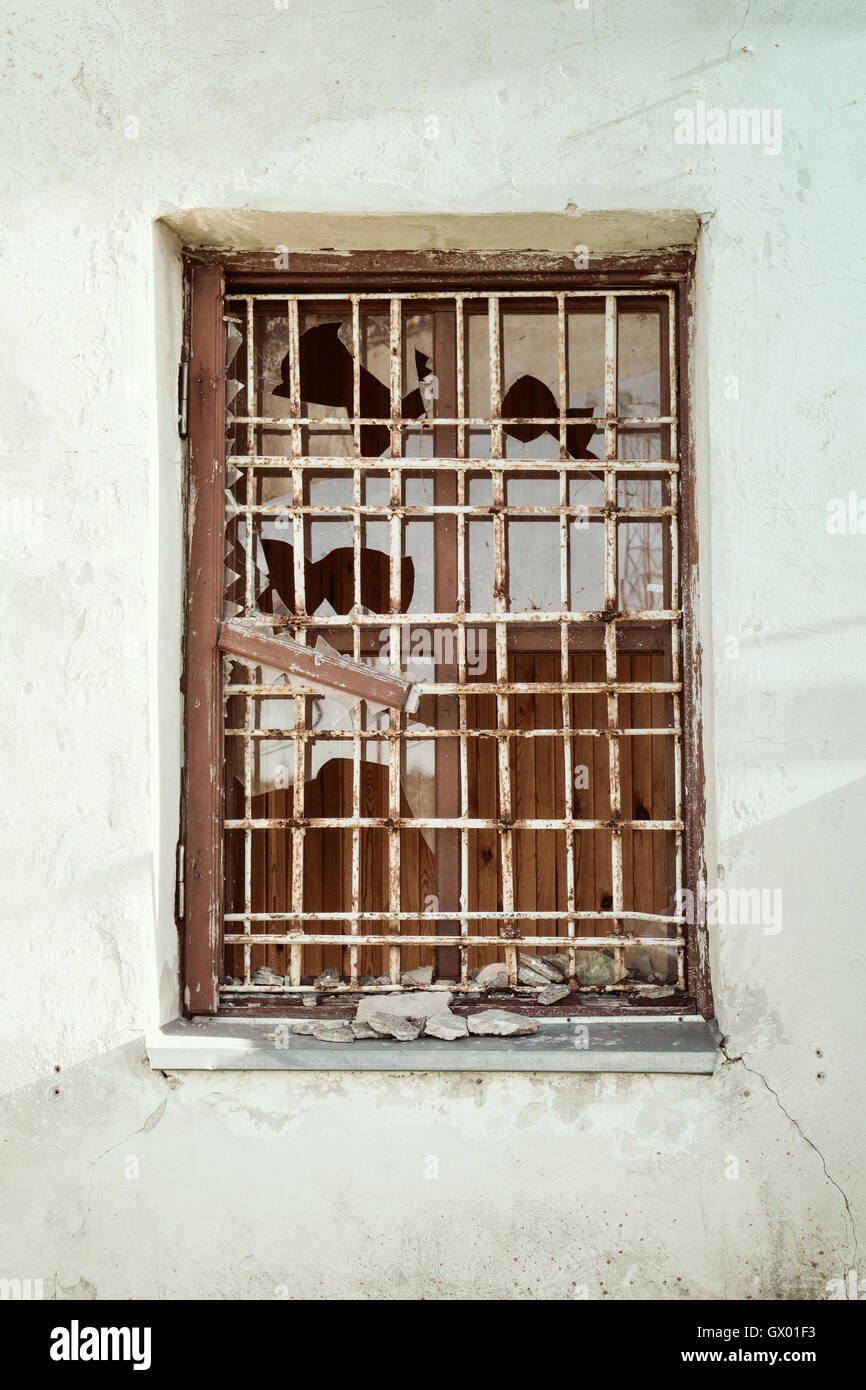 Old window with rusty iron bars and broken glass Stock Photo - Alamy