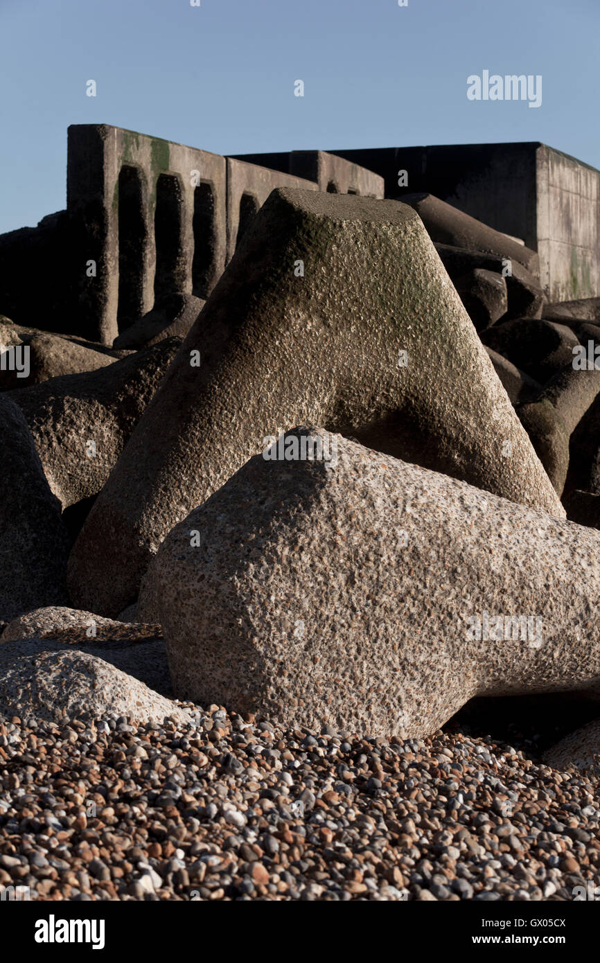 Wave rock barrier on the beach. Color photograph. Captured in Hastings ...