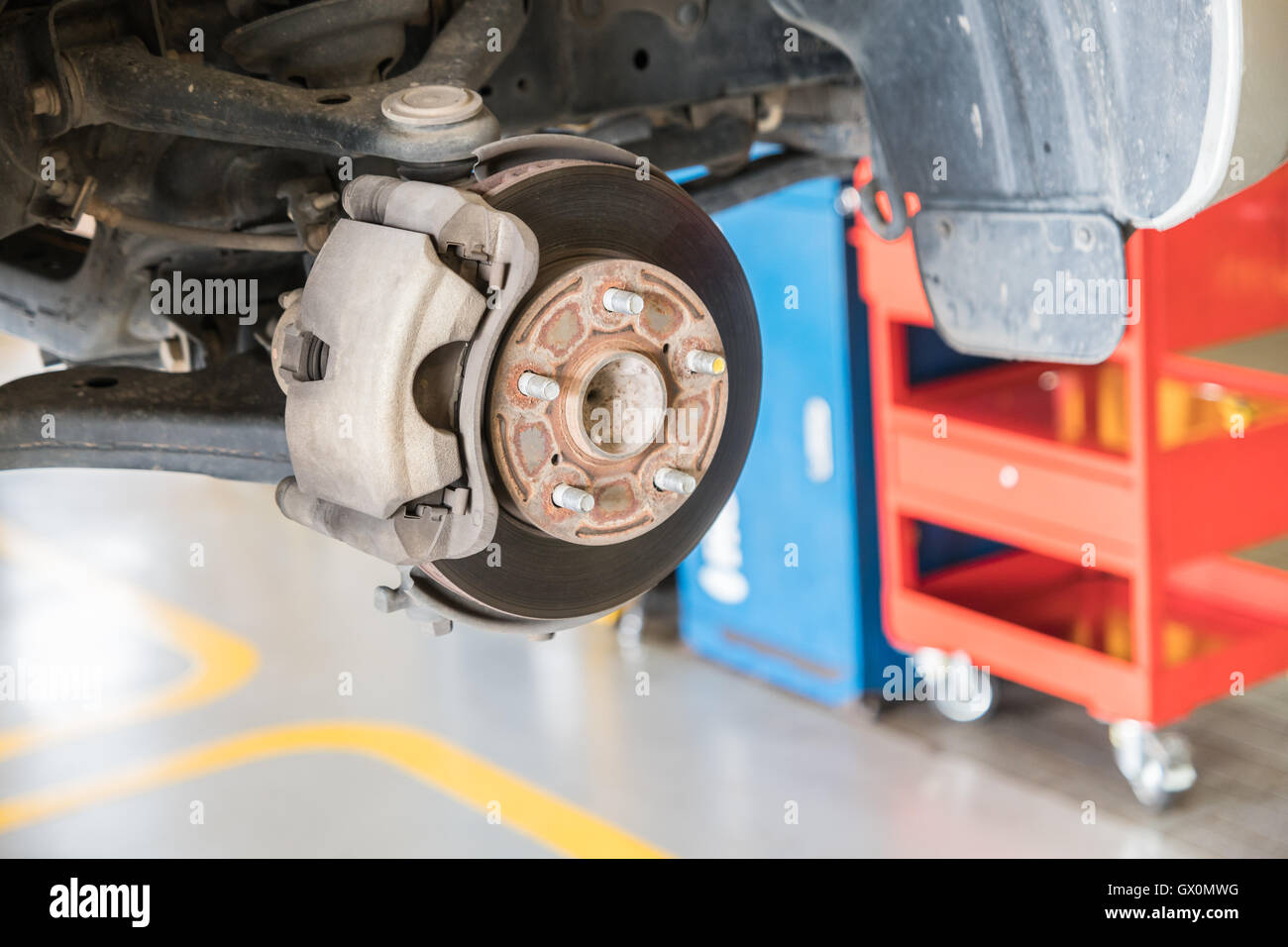Front disc brake on car in process of new tire replacement Stock Photo ...