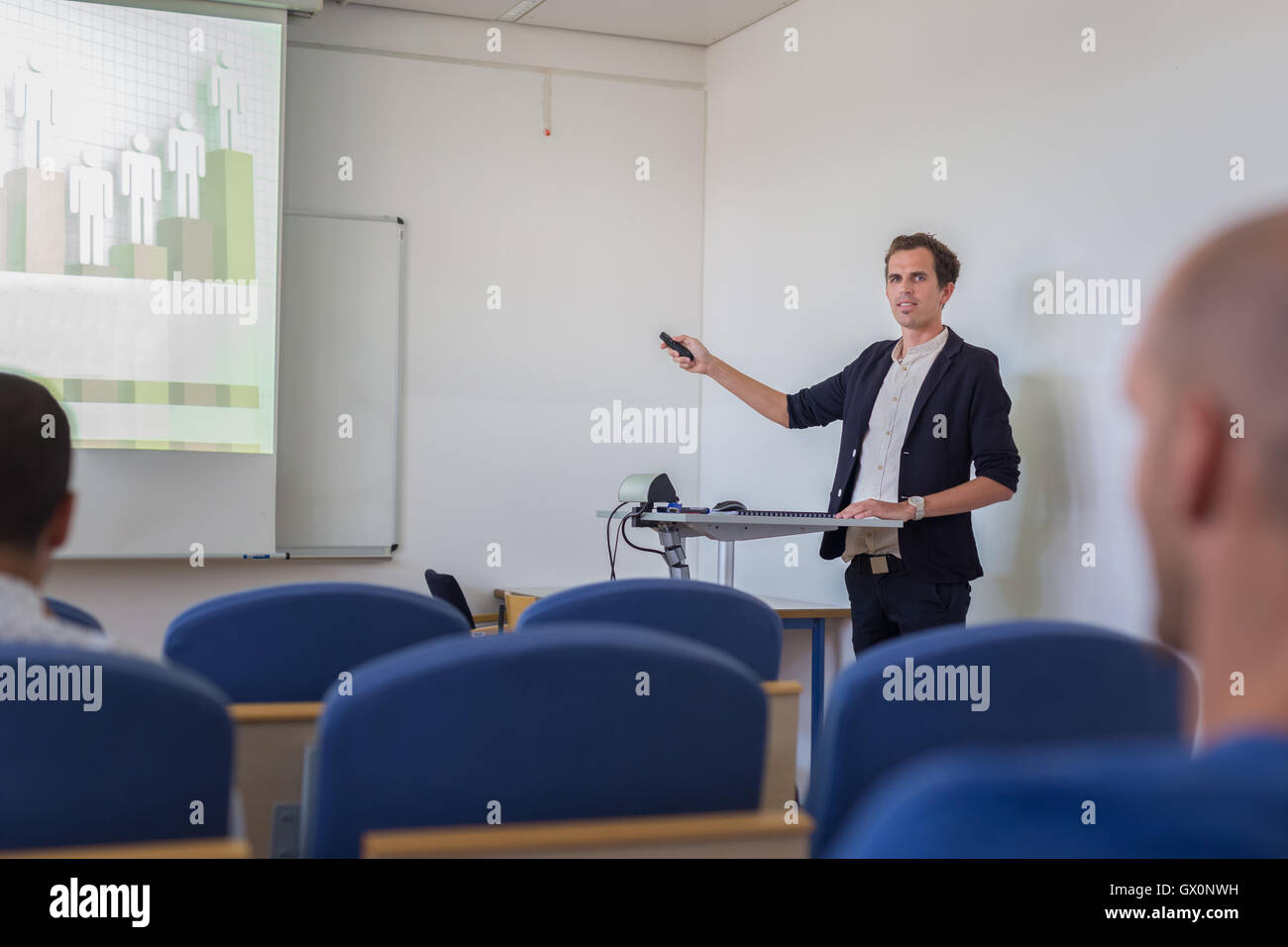 Student presenting his study work in front of whiteboard Stock Photo ...