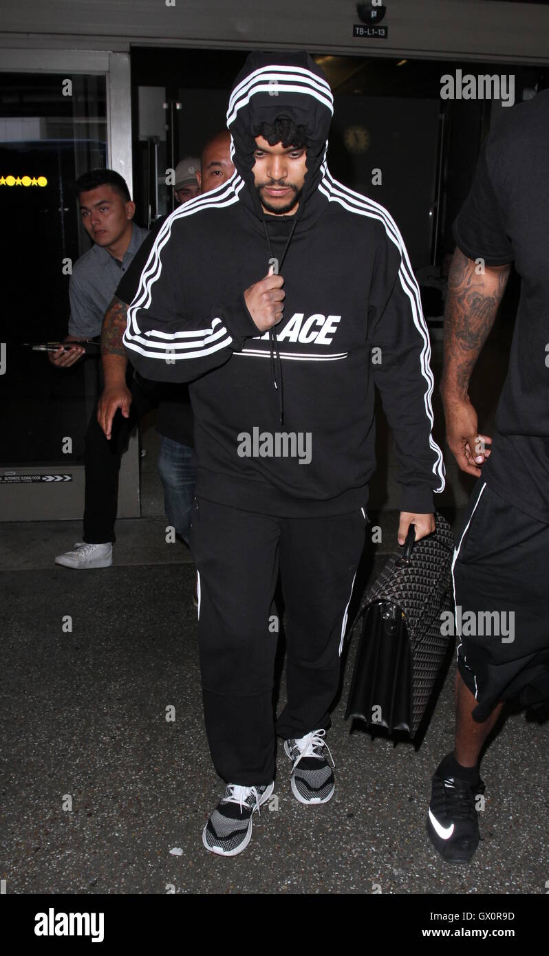 The Weeknd arrives at Los Angeles International Airport (LAX) Featuring ...