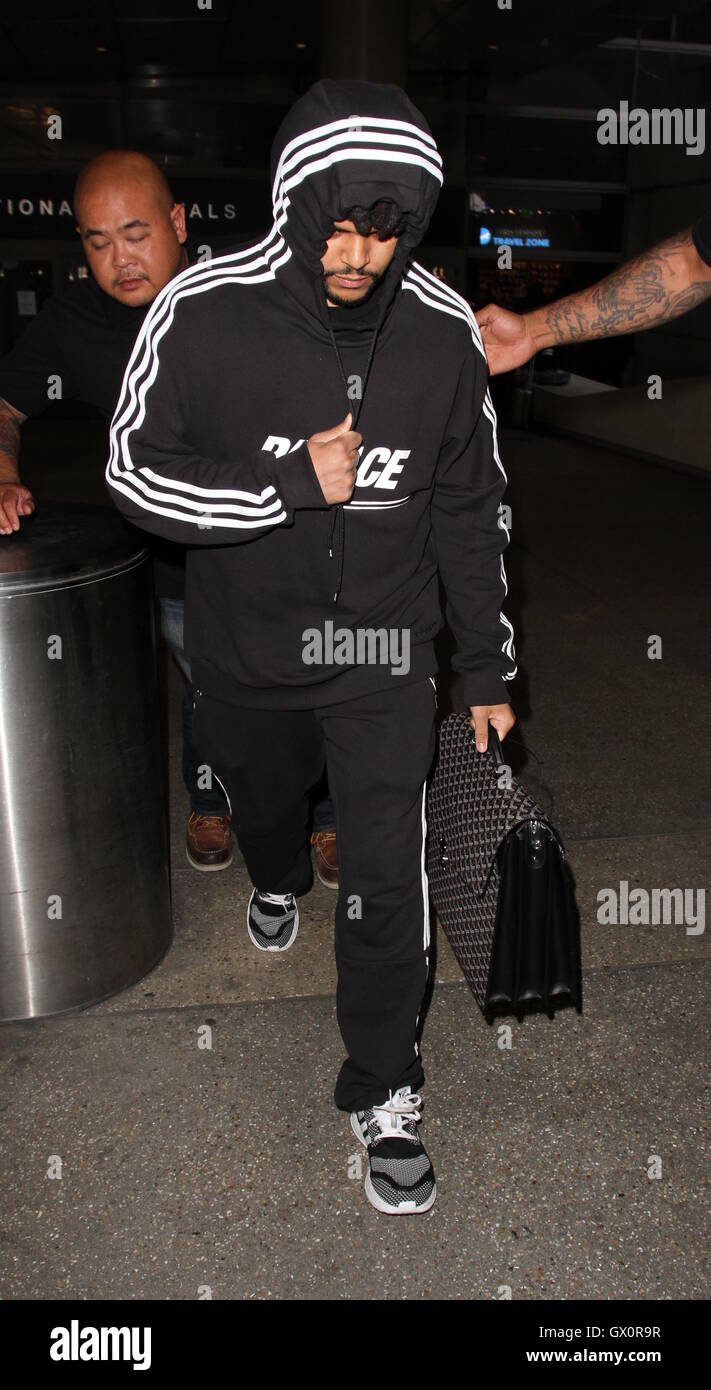 The Weeknd arrives at Los Angeles International Airport (LAX) Featuring ...