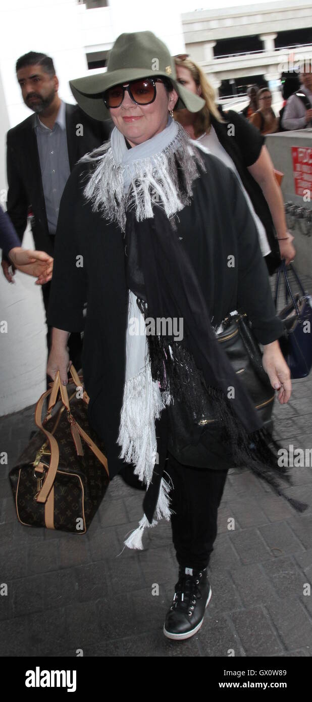 Melissa McCarthy leaves the airport with a smile on her face Featuring ...