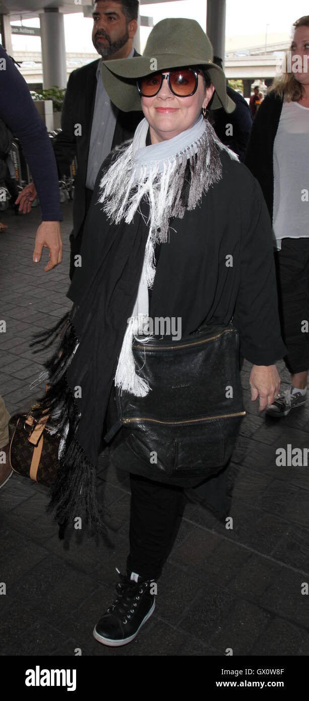 Melissa McCarthy leaves the airport with a smile on her face Featuring ...