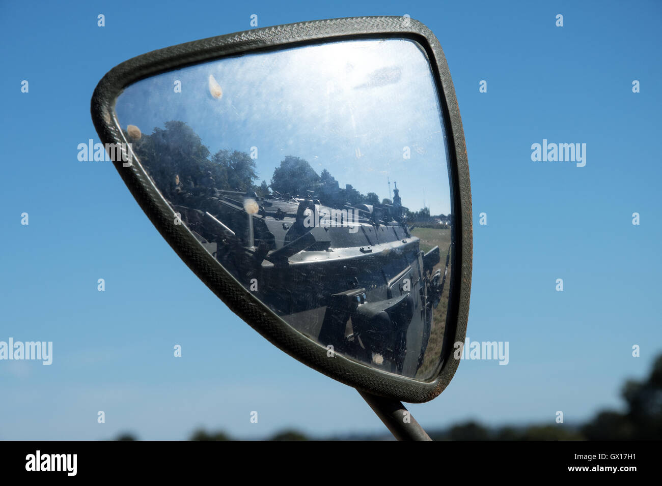 Reflection in the mirror of a military vehicle Stock Photo - Alamy