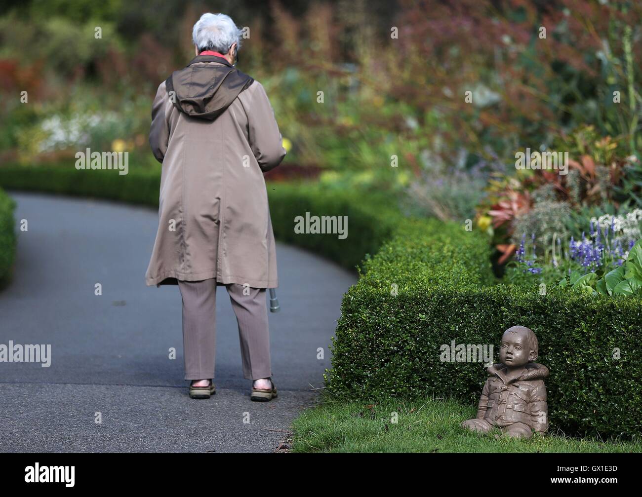 A woman walks by 'An Ri' by artist Eoin McMorrow which forms part of ...