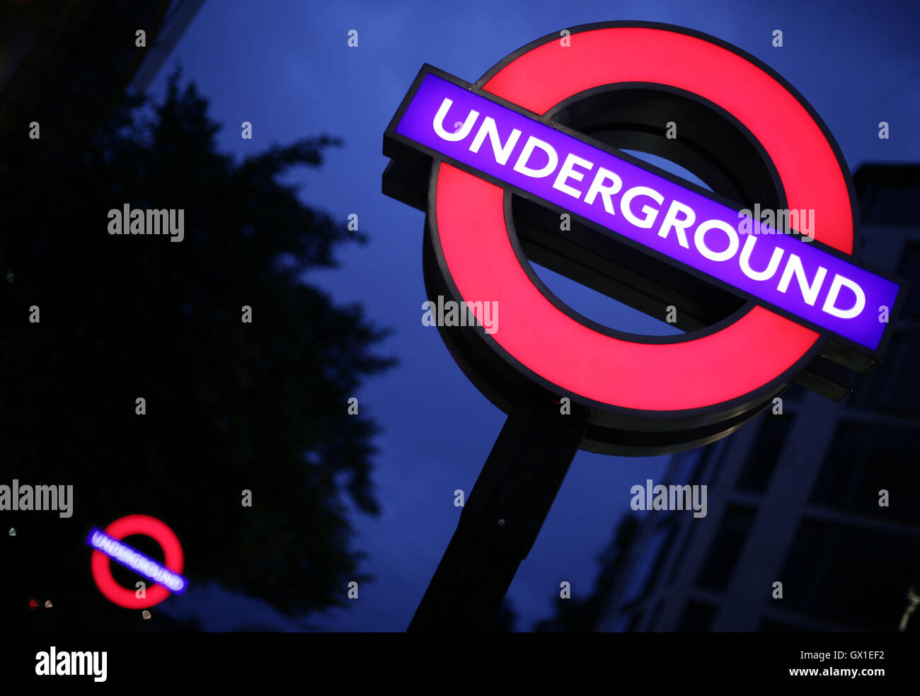 London underground sign against night sky outside st pauls station hi ...