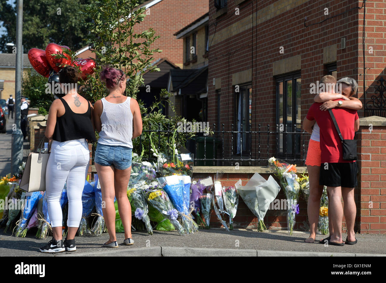 Perry Hayden (right wearing red) is comforted at the scene in Chadwell ...