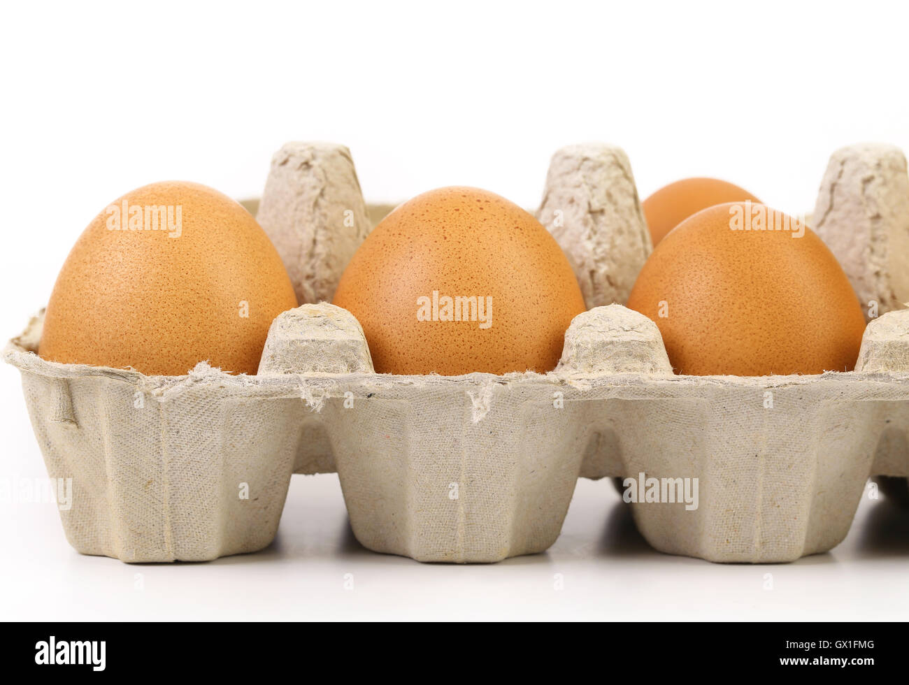 Four eggs in egg box hi-res stock photography and images - Alamy
