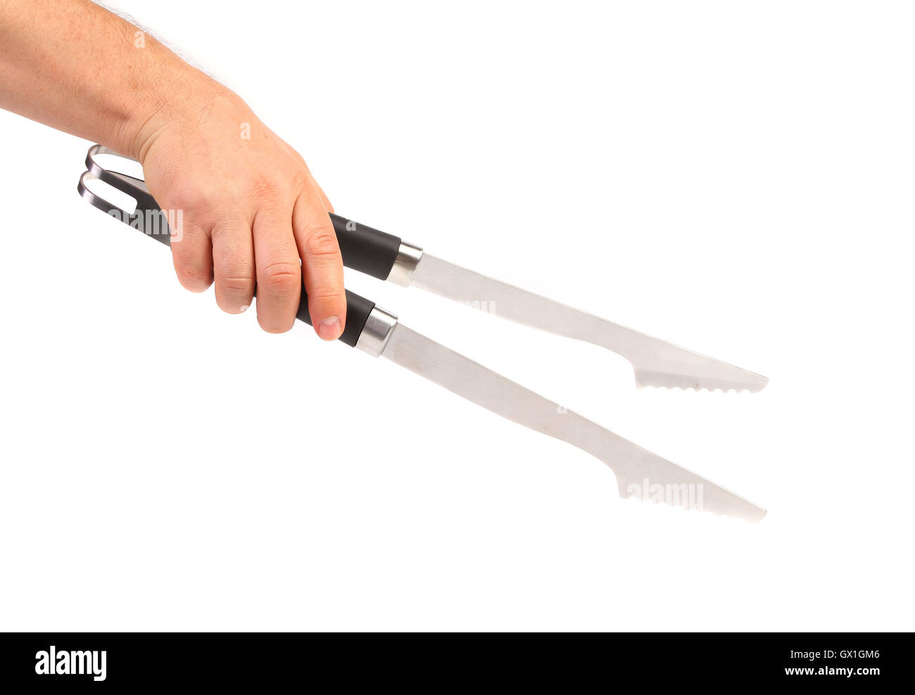 Hand holding bbq tongs Stock Photo - Alamy