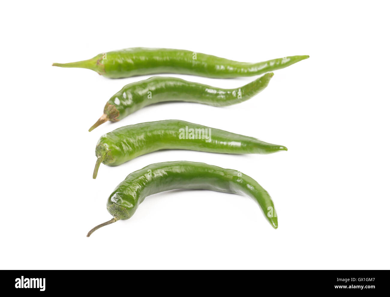 Four green peppers Stock Photo - Alamy